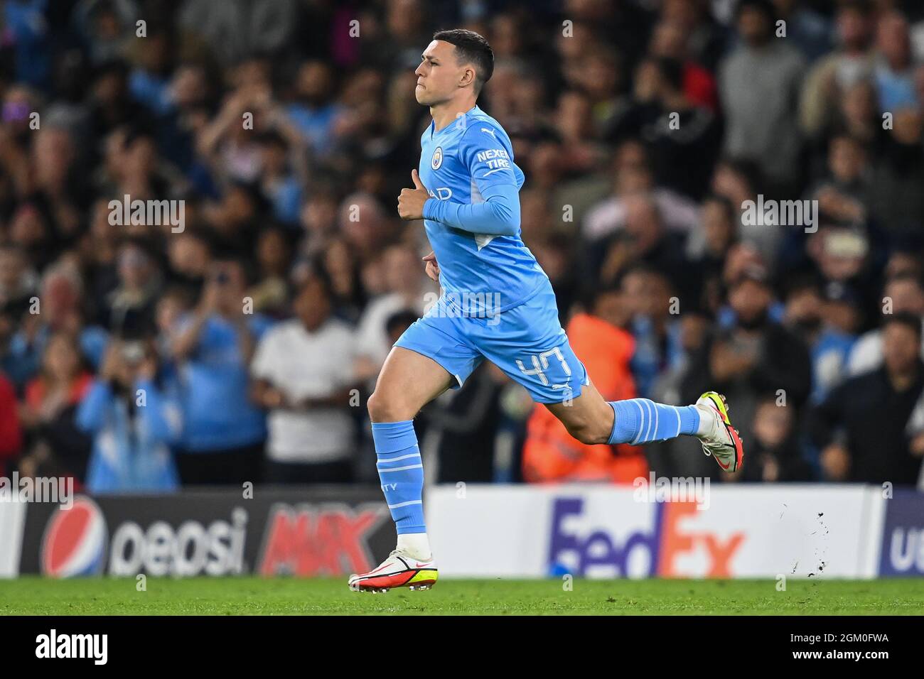 Phil Foden #47 of Manchester City comes onto the pitch in, on 9/15/2021 ...