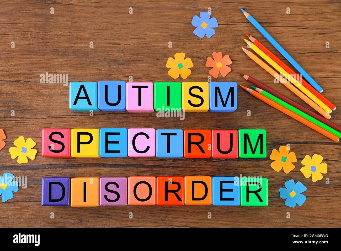 Colorful cubes with text on wooden background. Autism concept Stock ...