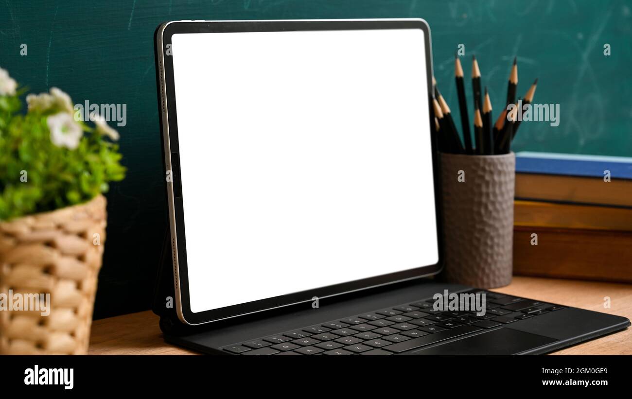 Student's study table with tablet blank screen mockup for montage your ...