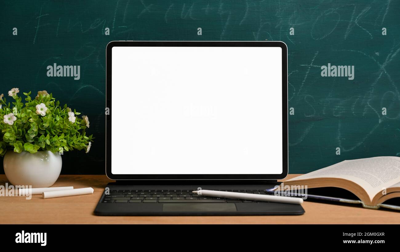 Back to school. Digital tablet with magic keyboard and stylus pen on ...