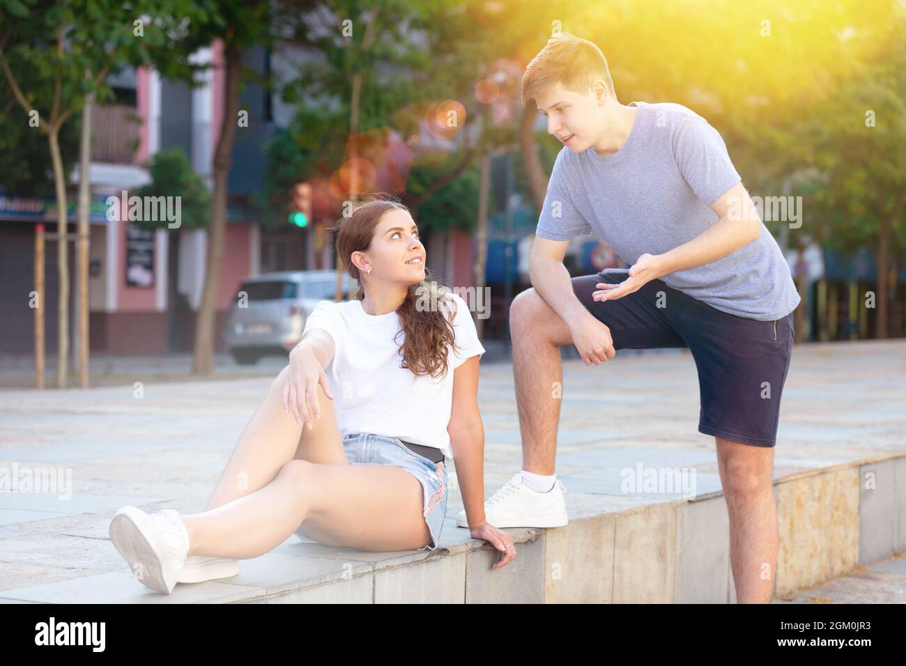 Portrait of two teenage friends chatting outdoors Stock Photo - Alamy