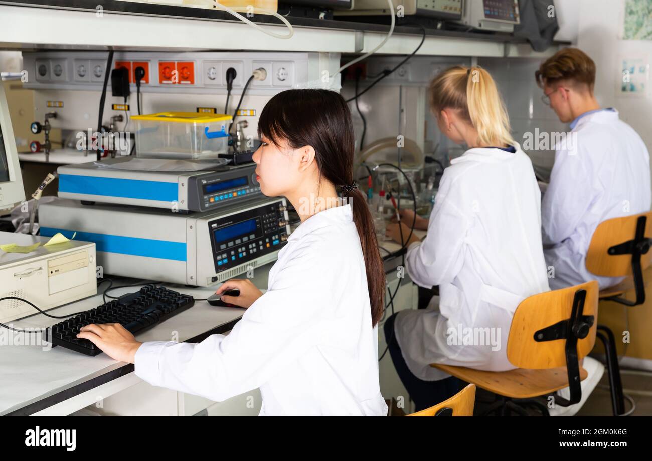 Group of scientists working together Stock Photo - Alamy