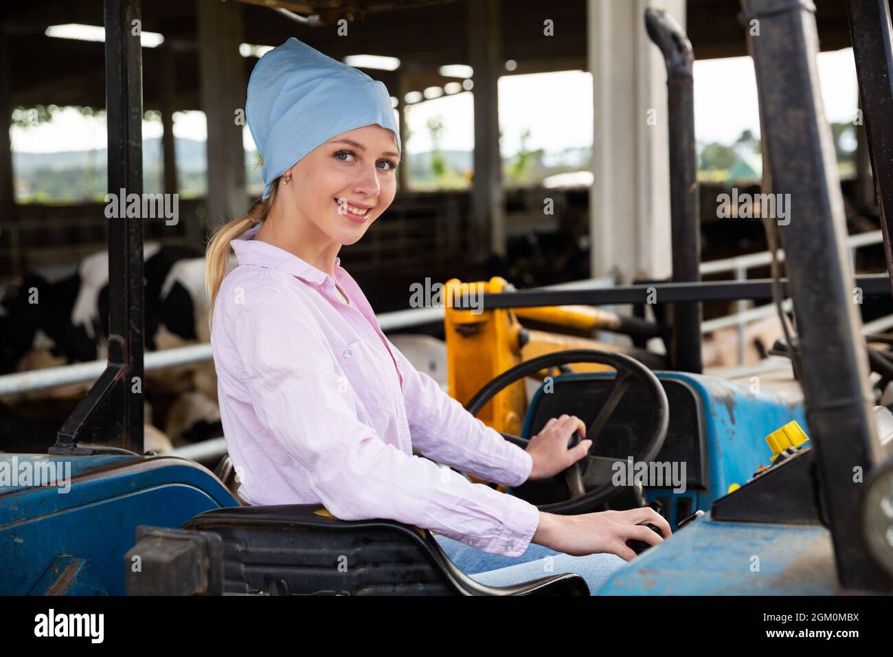 Young woman proffesional farmer is sitting in the car at the farm Stock ...