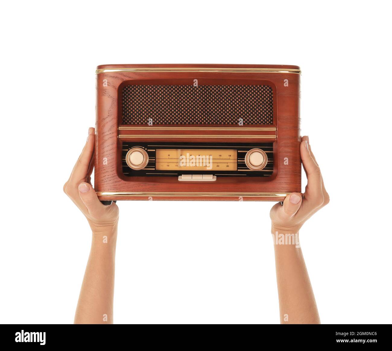 Woman holding radio on white background Stock Photo - Alamy