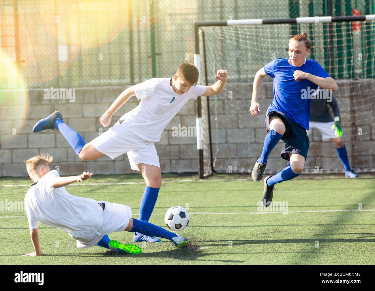 Teens playing soccer football match. Competition between two youth ...