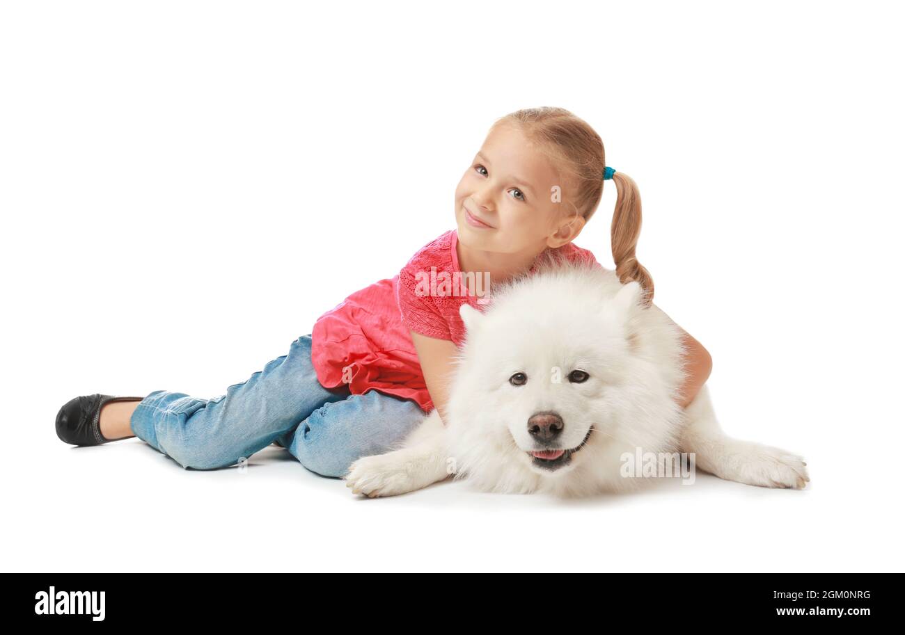 Cute little girl with dog on white background Stock Photo - Alamy