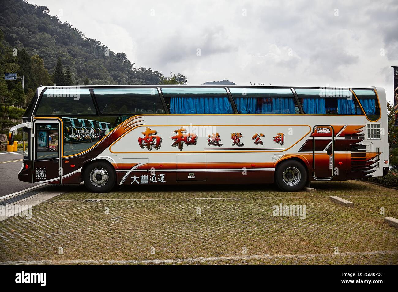 View of a colourful bus parked at the Sun Moon lake in Nantou county ...