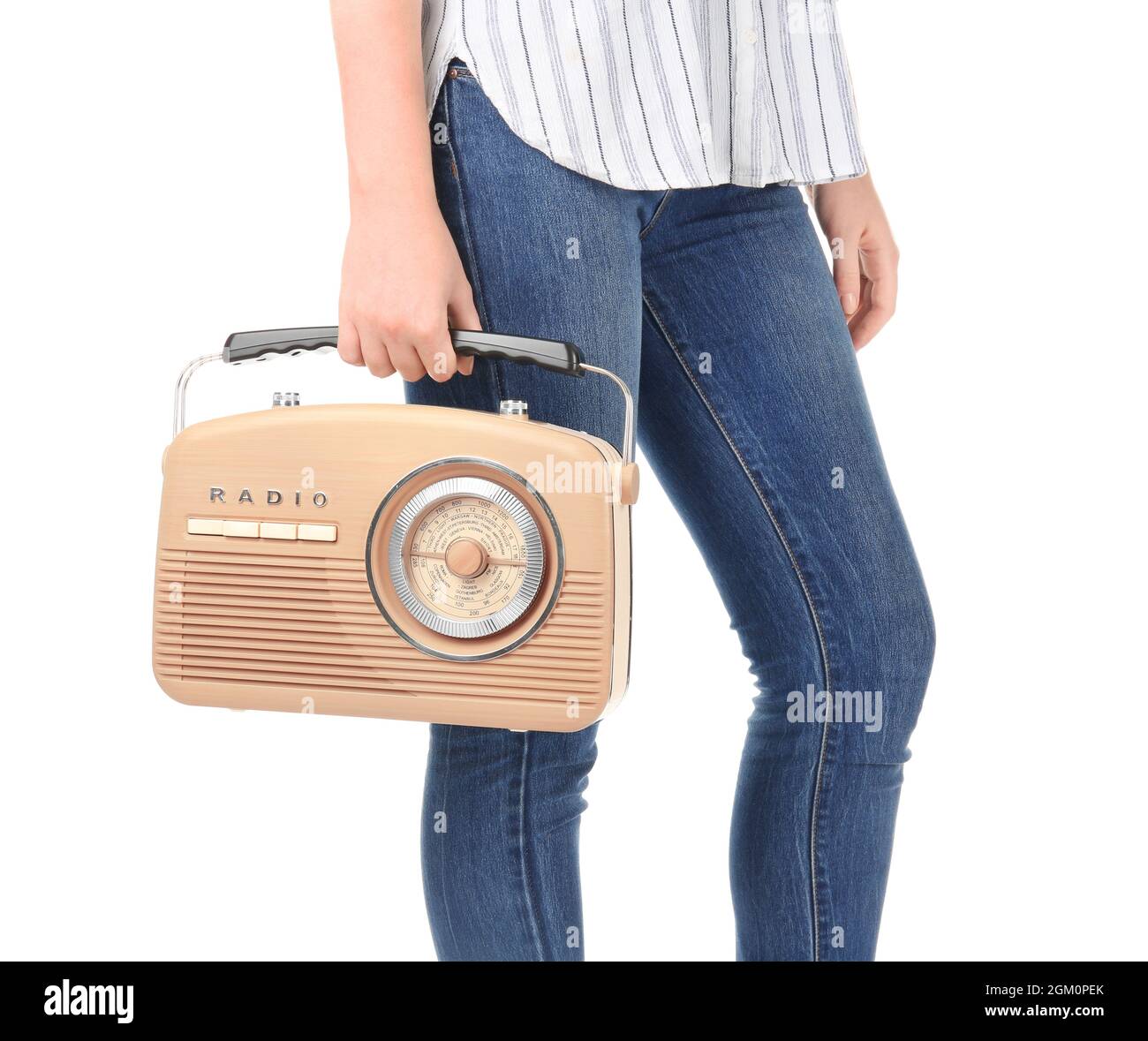 Woman holding radio on white background Stock Photo - Alamy
