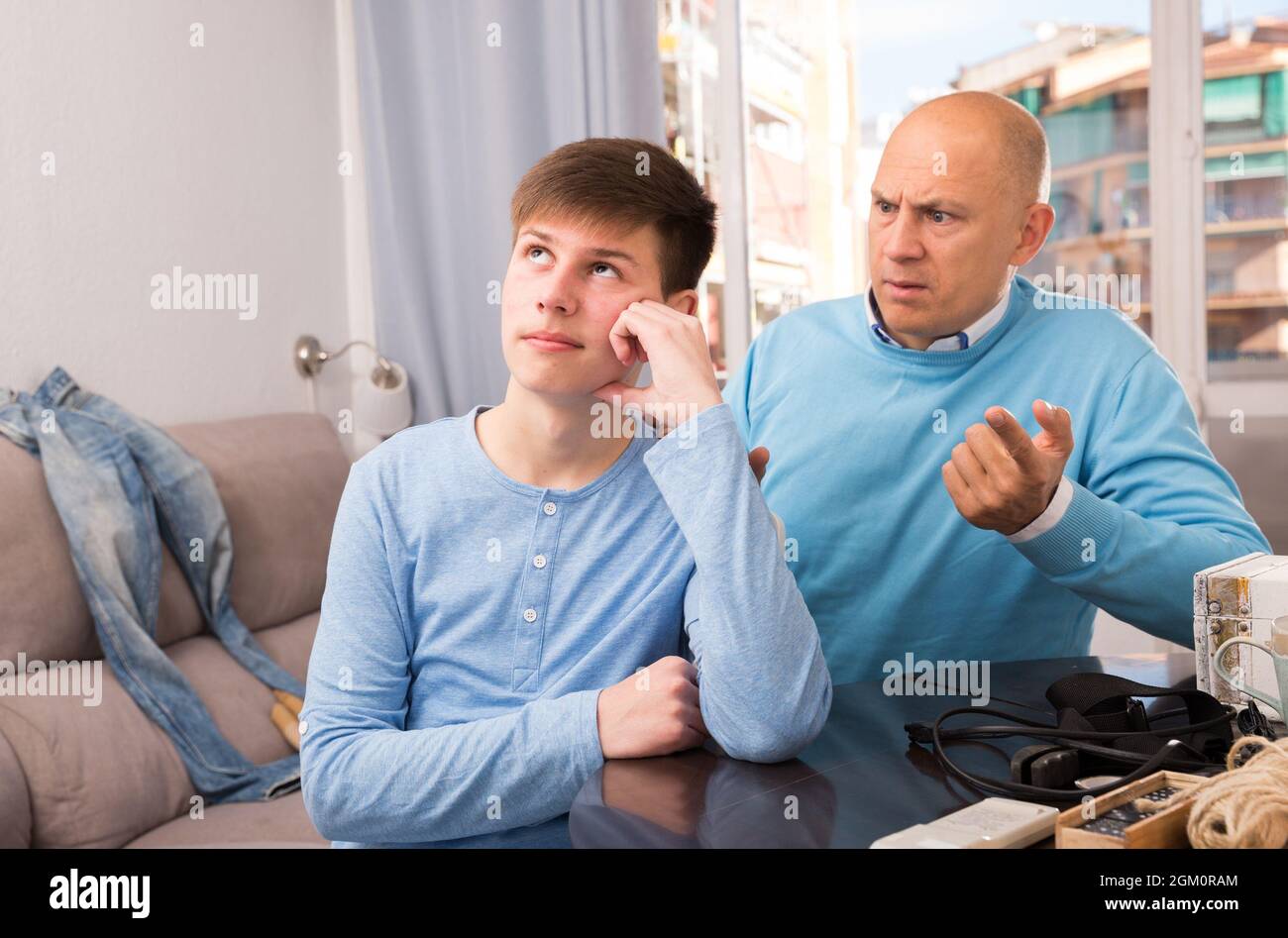 Man scolding son at home Stock Photo - Alamy