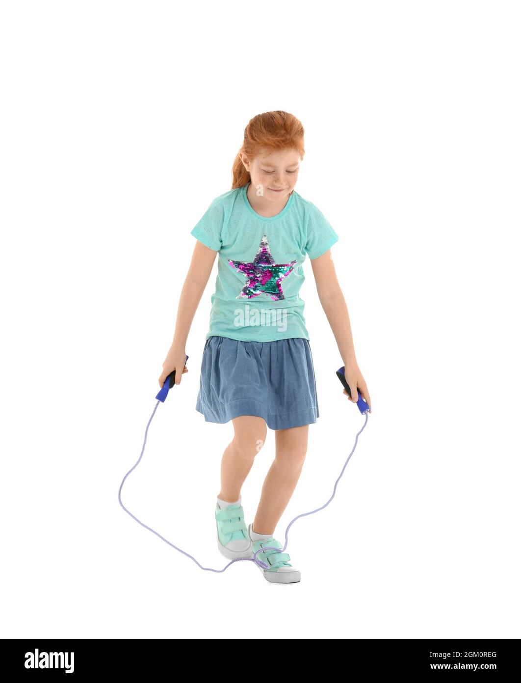 Cute little girl jumping rope on white background Stock Photo - Alamy