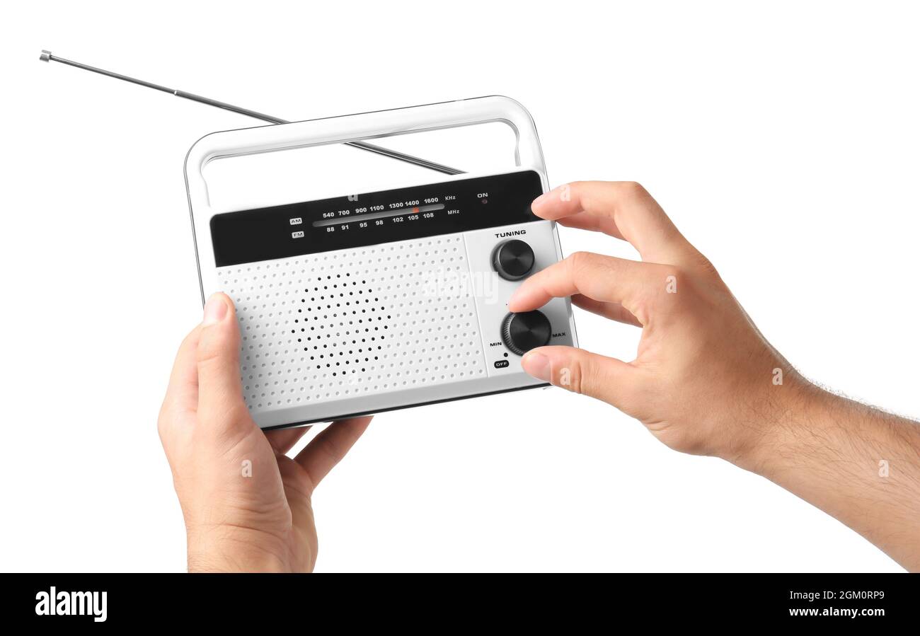 Young man holding retro radio on white background Stock Photo - Alamy