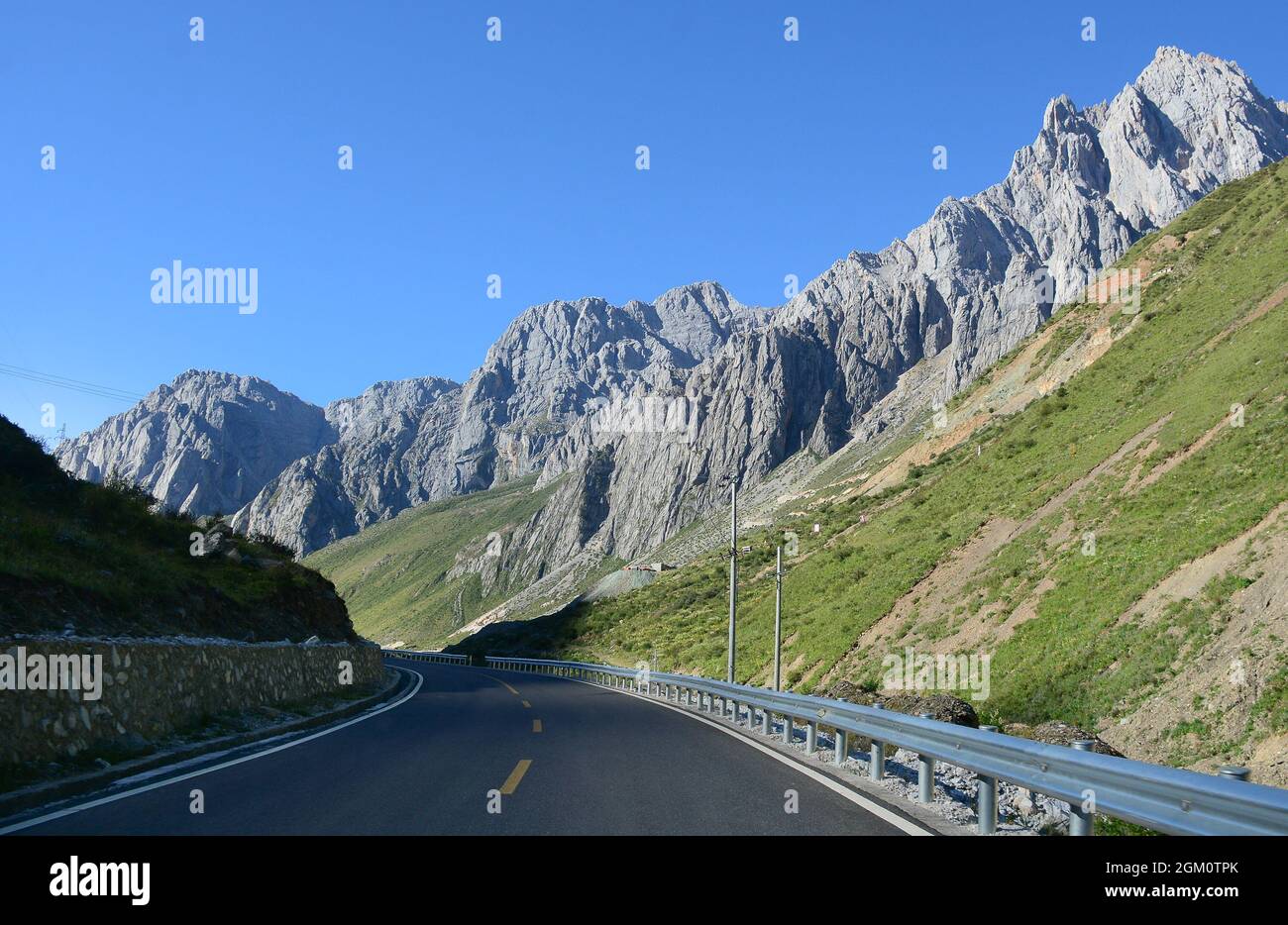 Mountain highway of Tibetan Kham, China. Kham is the easternmost part ...