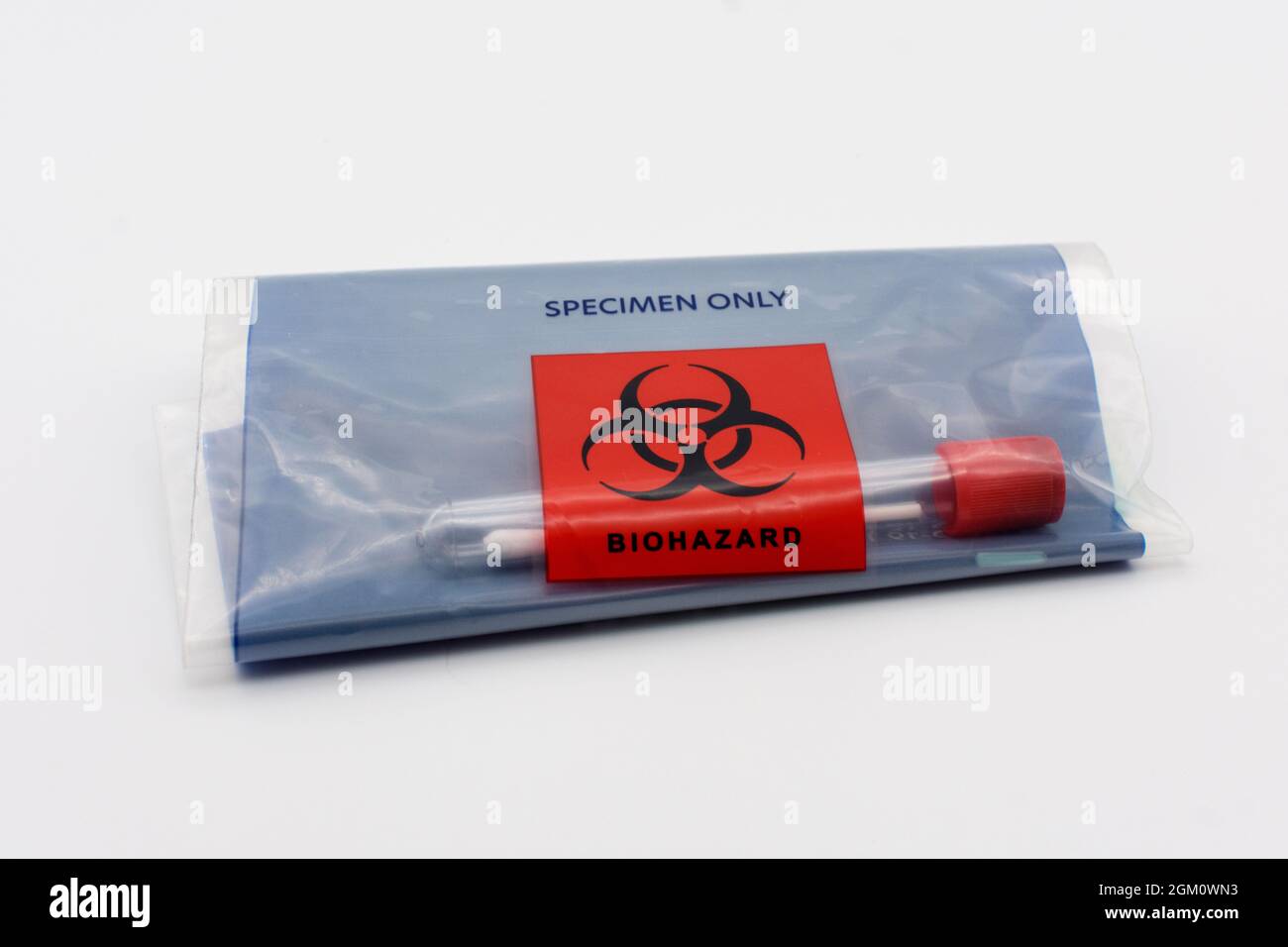 Specimen collection tube with swab in biohazard bag Stock Photo - Alamy