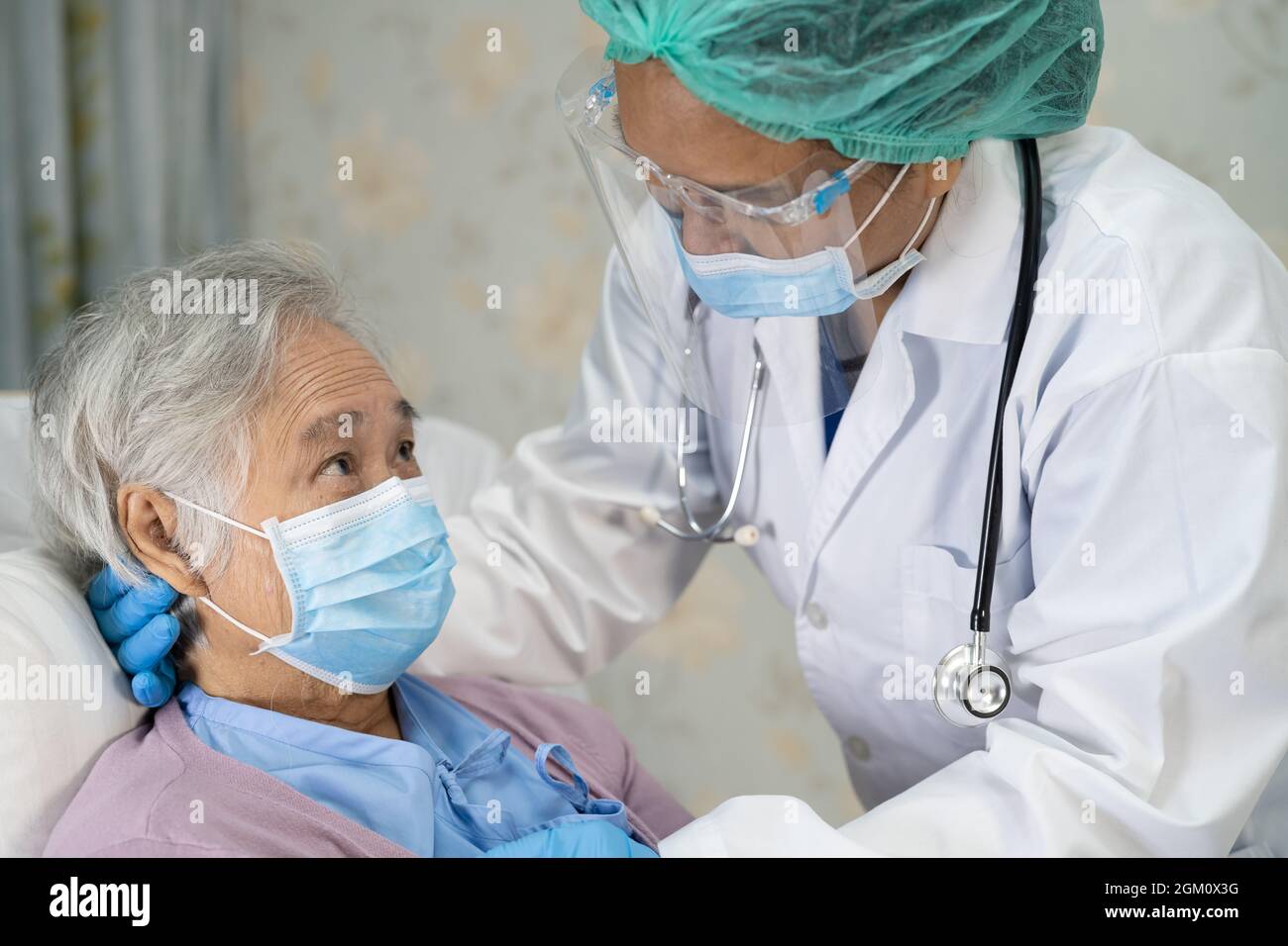 Doctor holding hands Asian senior or elderly old lady woman infected ...
