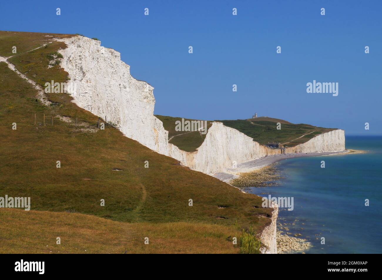 White chalk cliffs, the English Channel, Birling Gap and Belle Tout ...