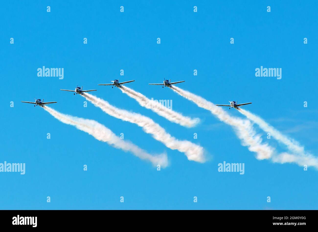 Aerobatic team aircraft fighters trail of smoke in the sky Stock Photo ...