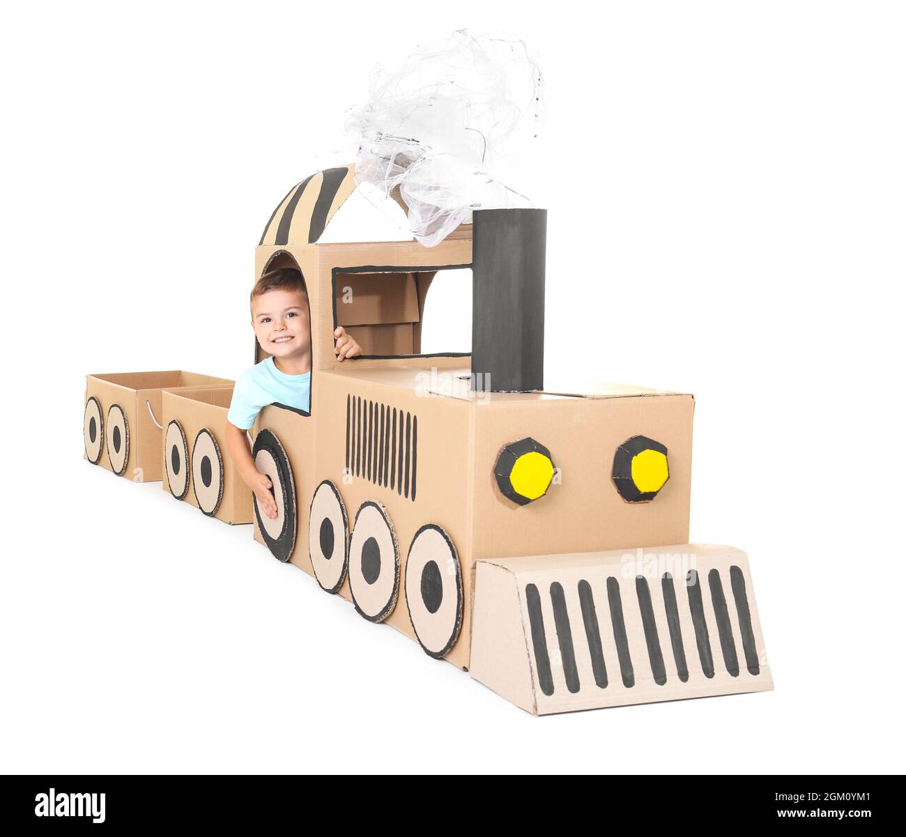 Little boy playing with cardboard train on white background Stock Photo ...