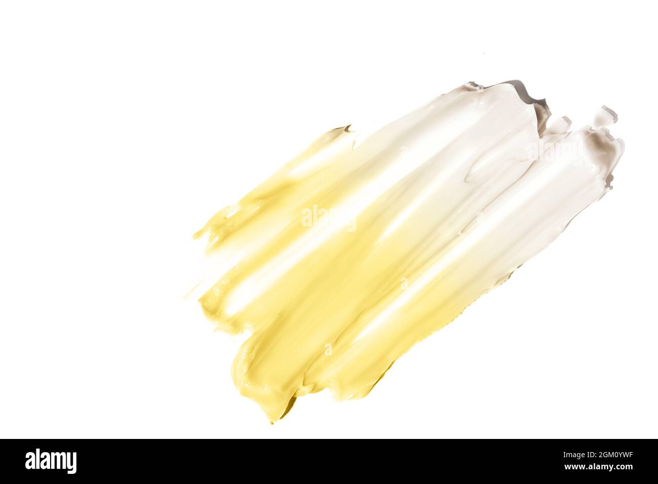 The smear and texture of the cream. Yellow-white color, isolated on a ...