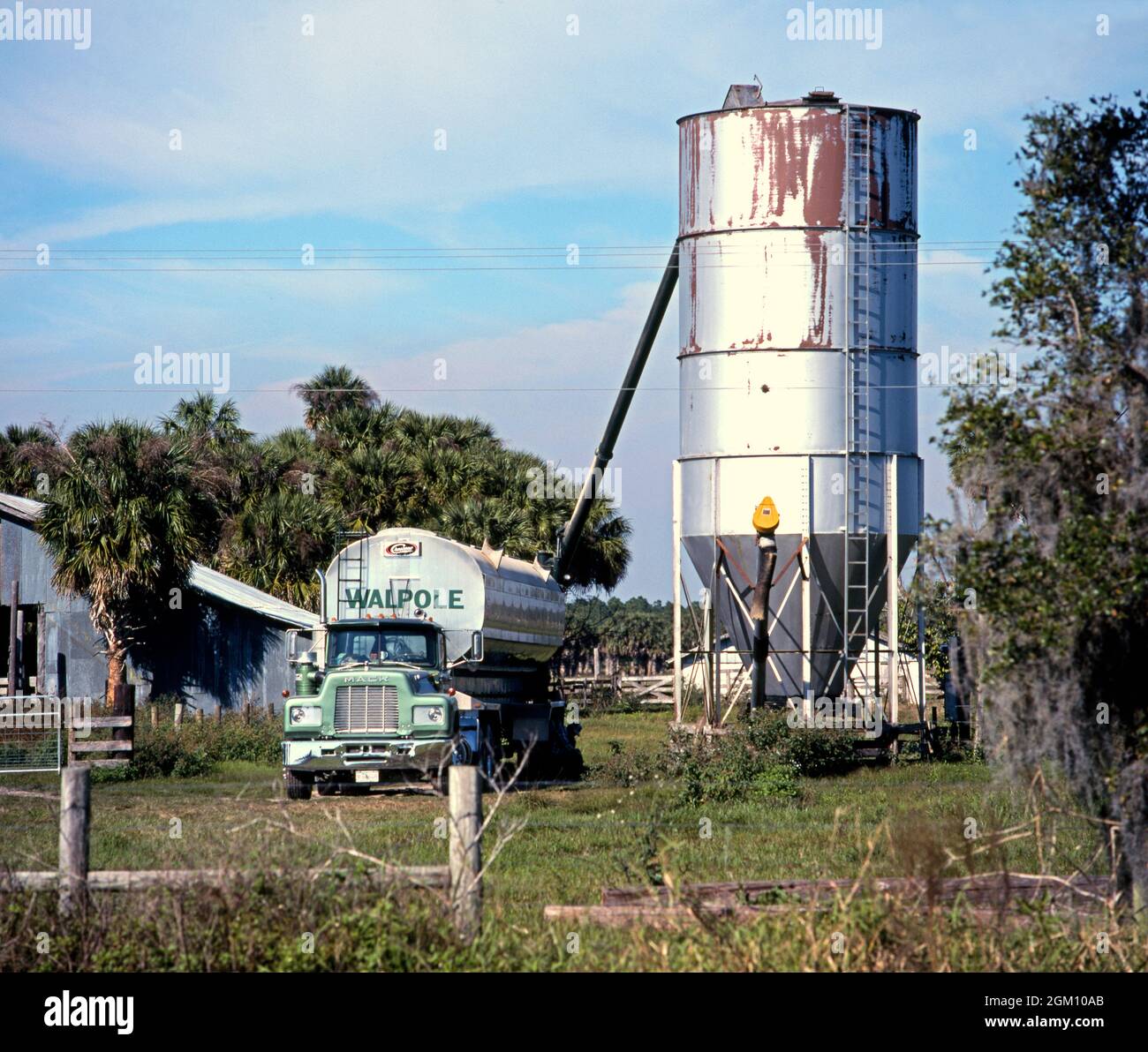 Agricultural Hopper alongside a 'MACK' truck and tanker trailer, South ...