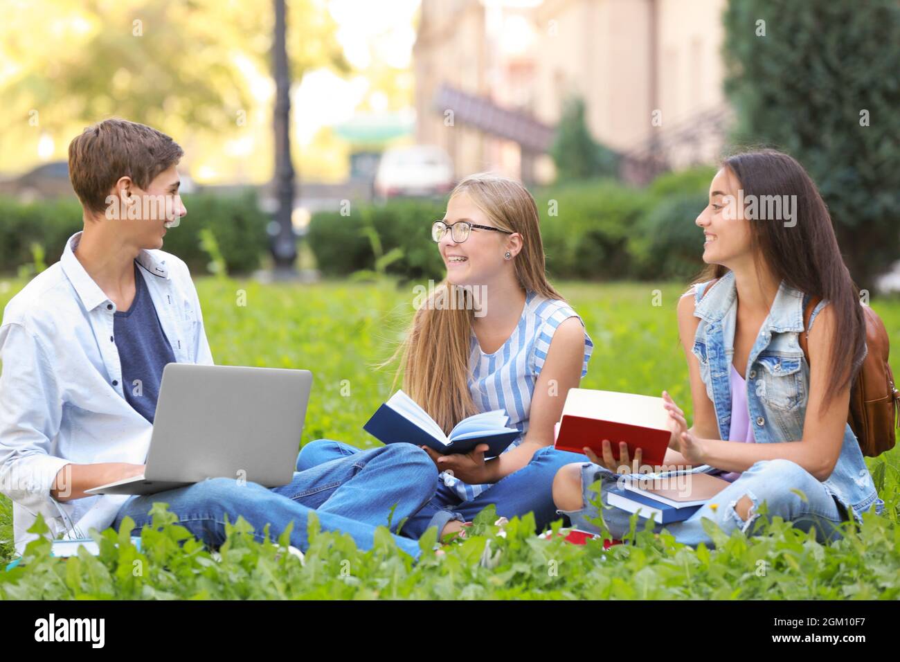 Young students studying outdoors Stock Photo - Alamy
