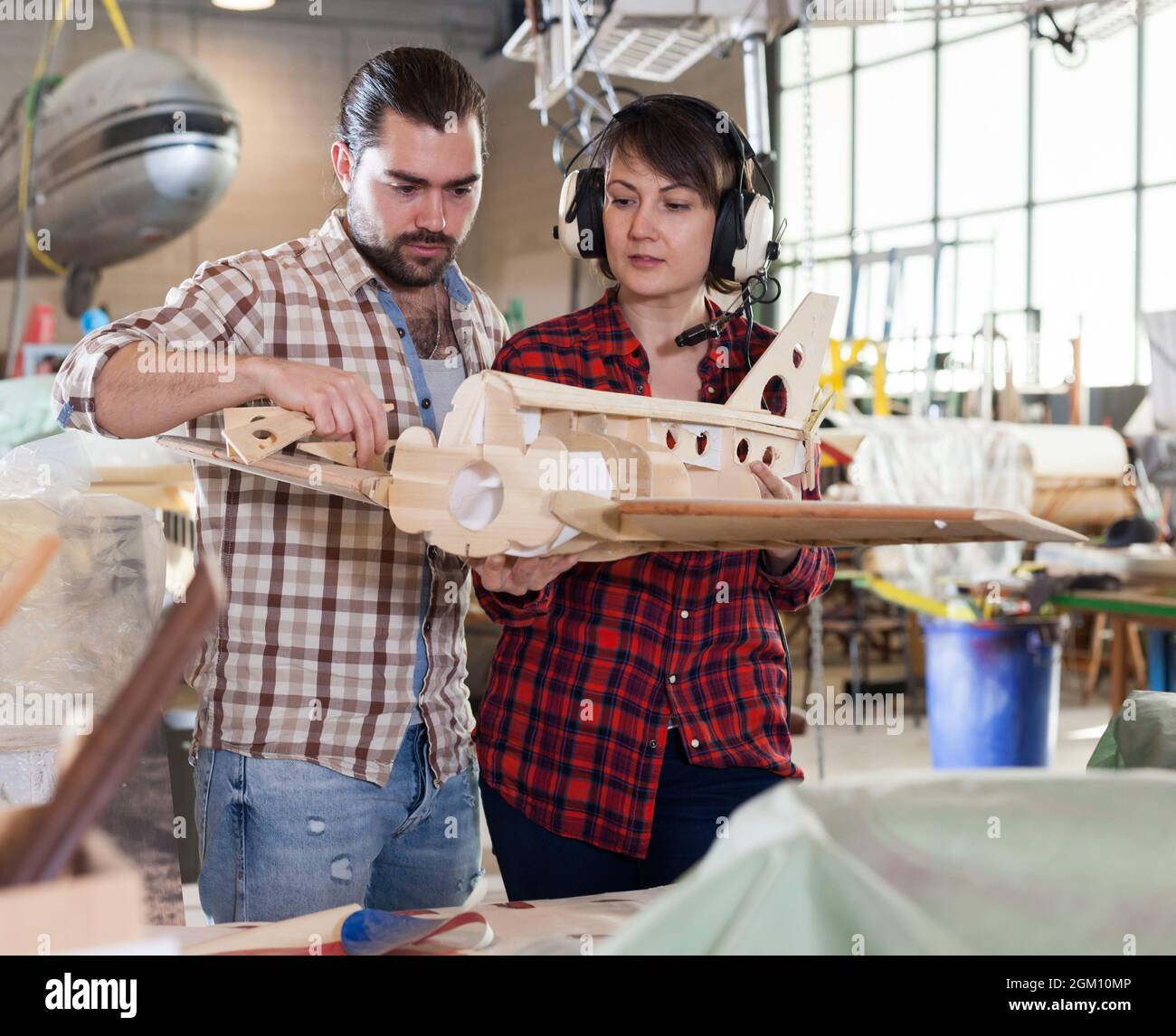 Female and male creating plane models Stock Photo - Alamy