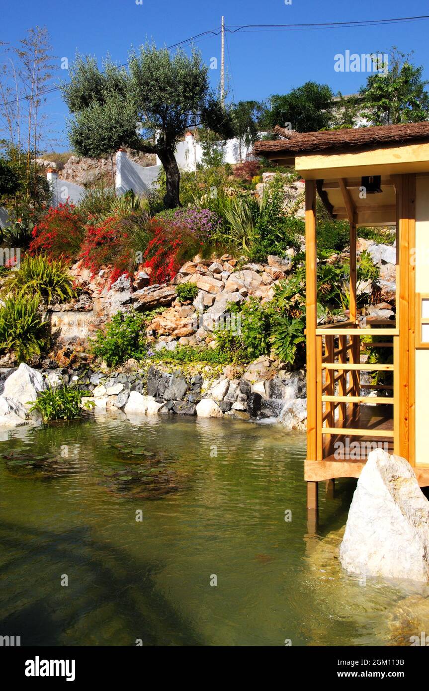 Wooden building on stilts in an ornamental pool in the Oriental garden ...