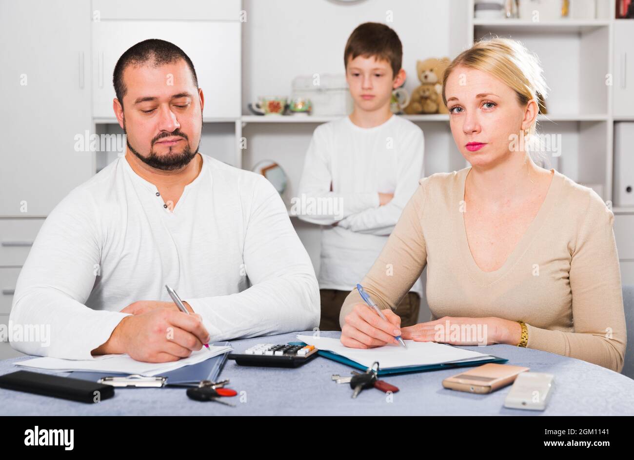 Serious family working with papers Stock Photo - Alamy