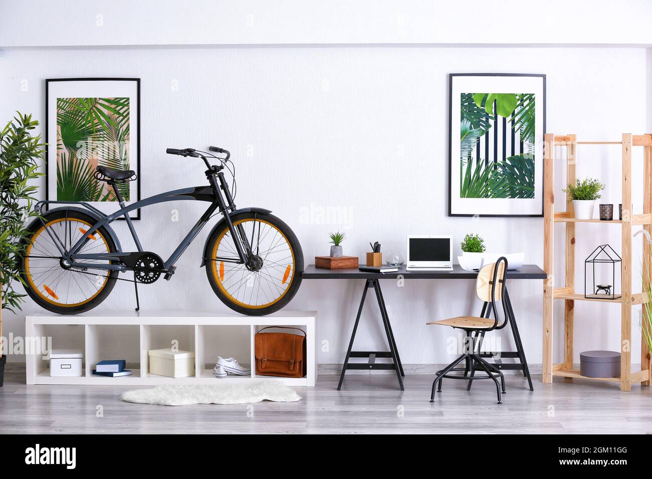 Modern room interior with bicycle and workplace Stock Photo - Alamy