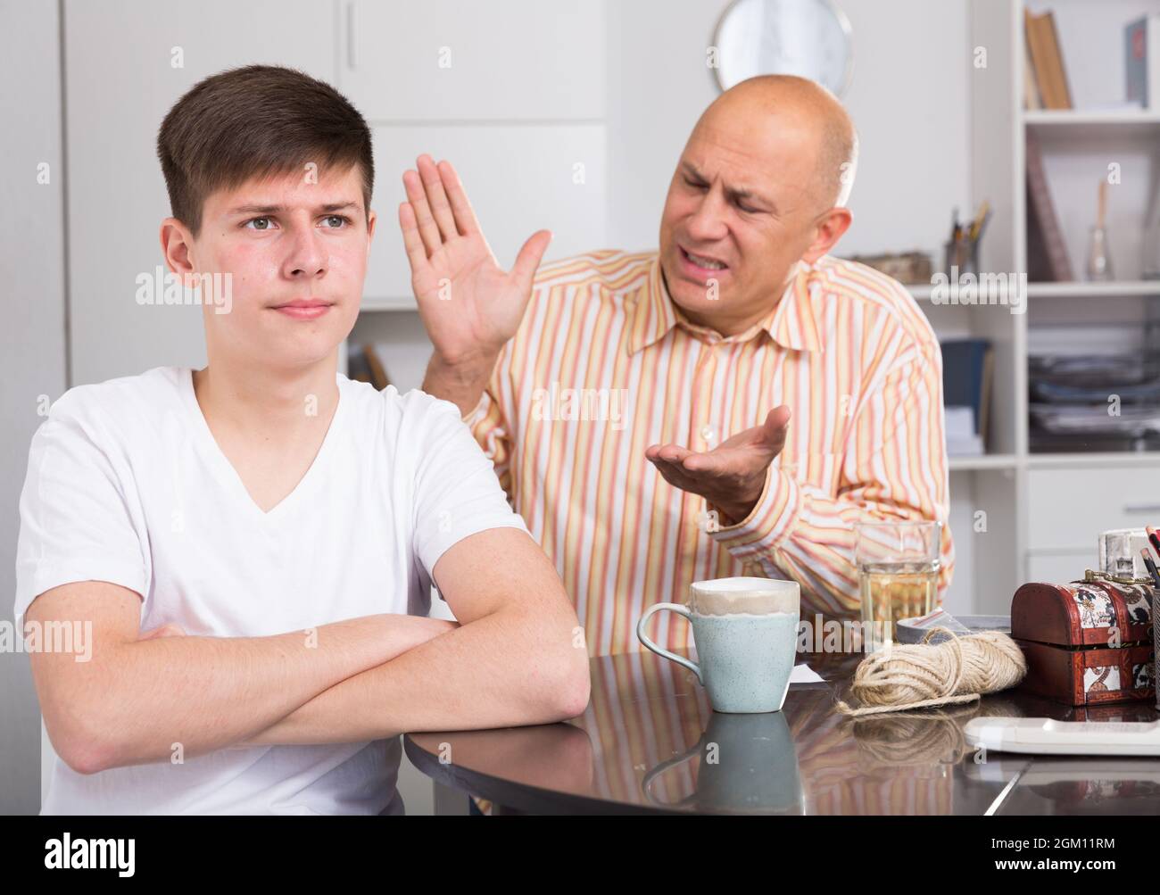 Man scolding his teenage son Stock Photo - Alamy