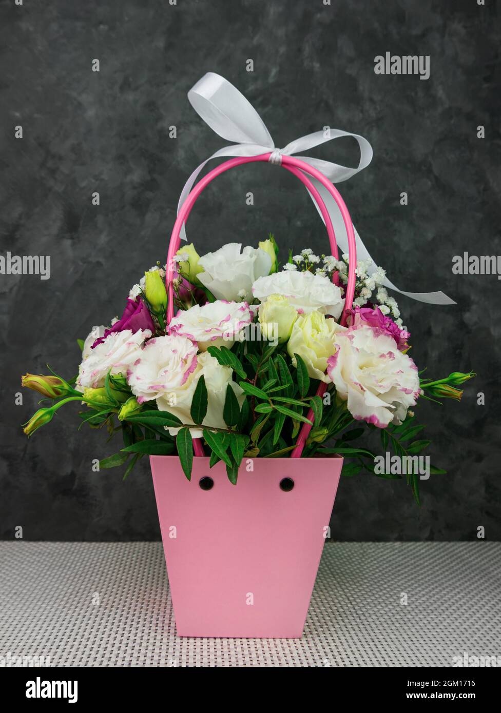 Beautiful white Eustoma Gypsophila flowers bouquet in pink pastel ...