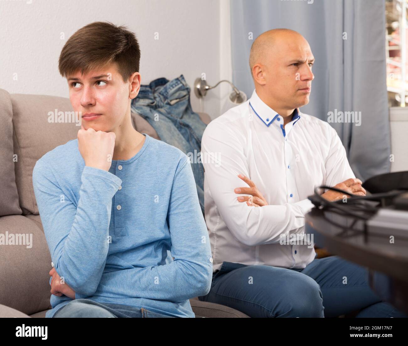 Father and teenage son after quarrel Stock Photo - Alamy
