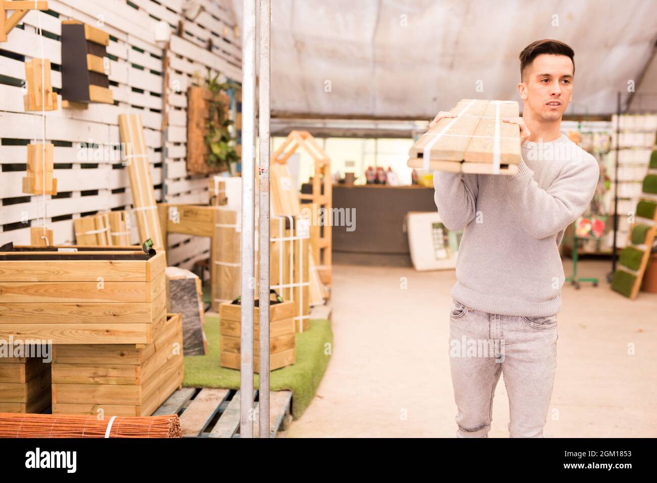 Male customer selecting construction materials in hardware store Stock ...