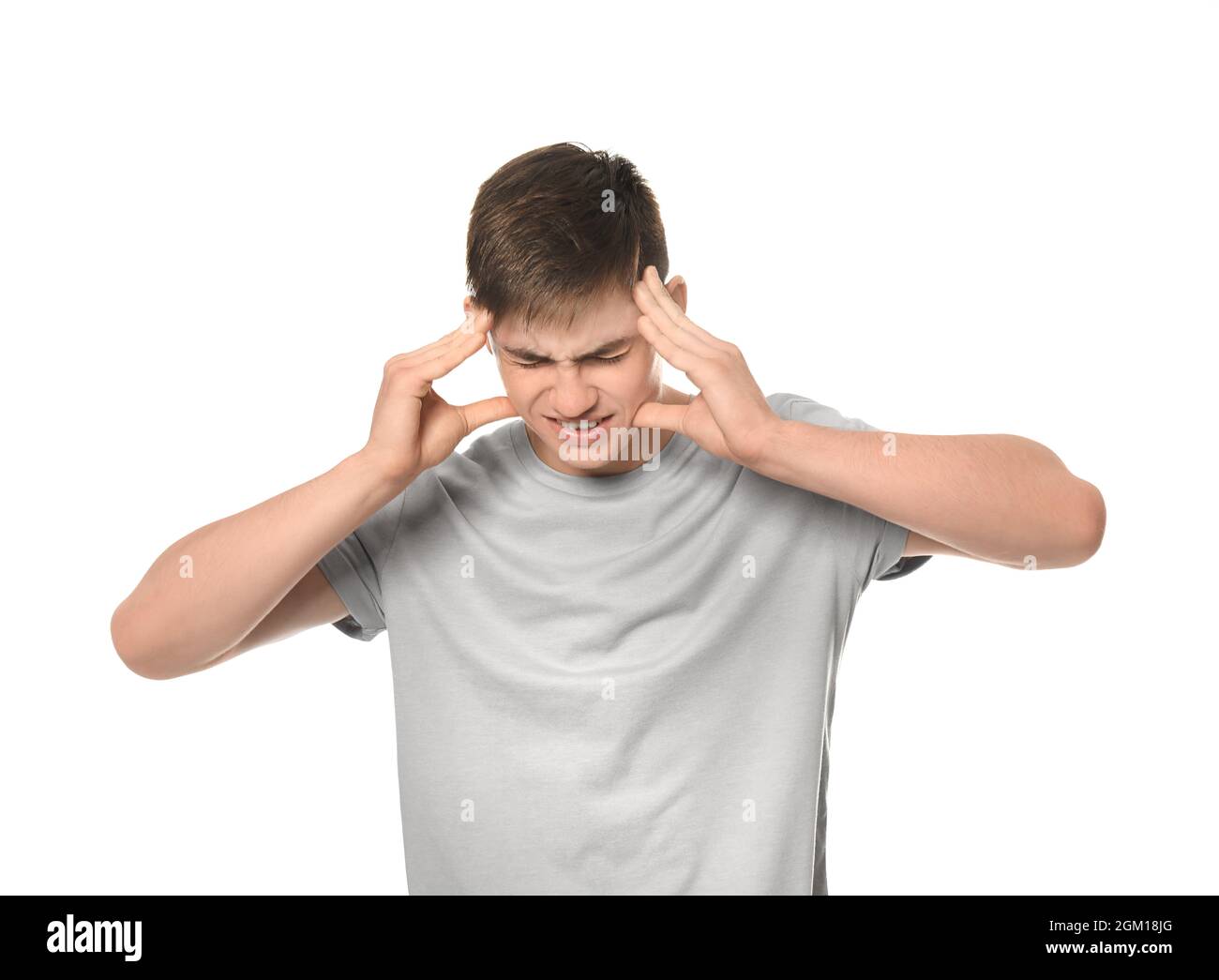 Stressed teenage boy on white background Stock Photo - Alamy