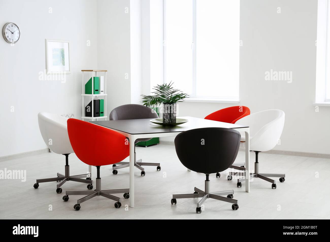 Modern room interior with big table and chairs Stock Photo - Alamy