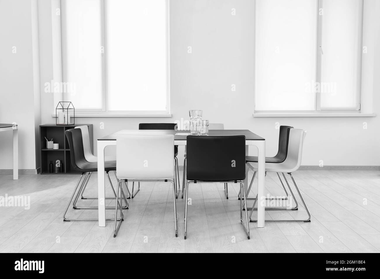 Modern room interior with big table and chairs Stock Photo - Alamy