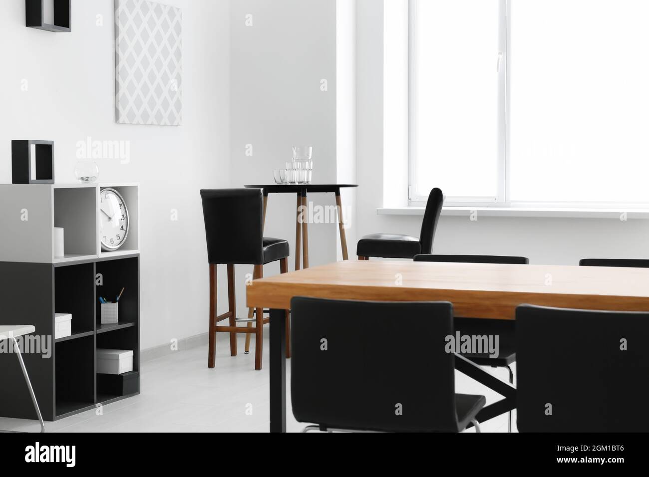 Modern room interior with big table and chairs Stock Photo - Alamy