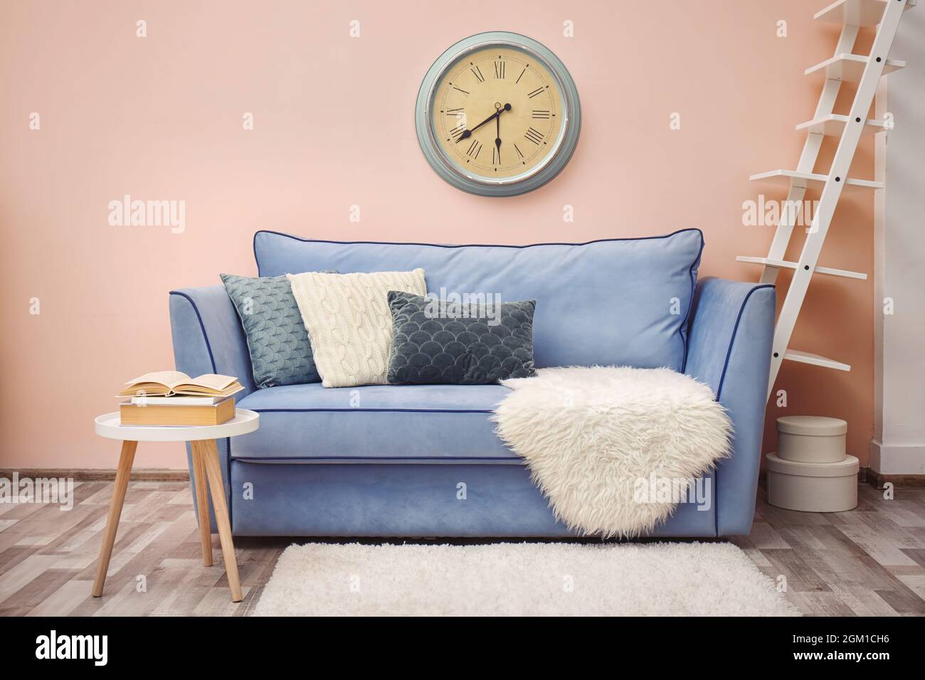 Modern room design with blue sofa Stock Photo - Alamy