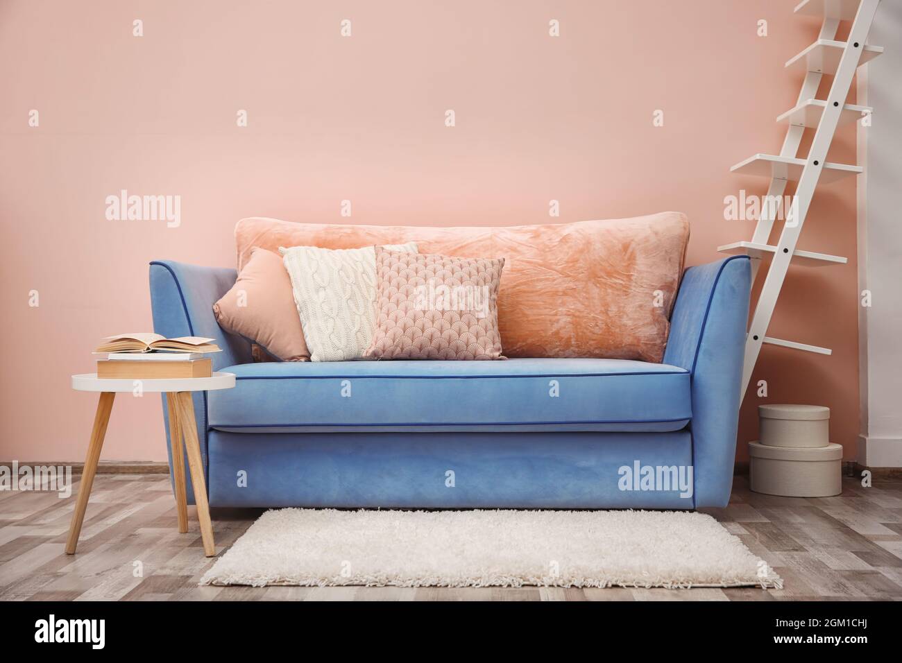 Modern room design with blue sofa Stock Photo - Alamy