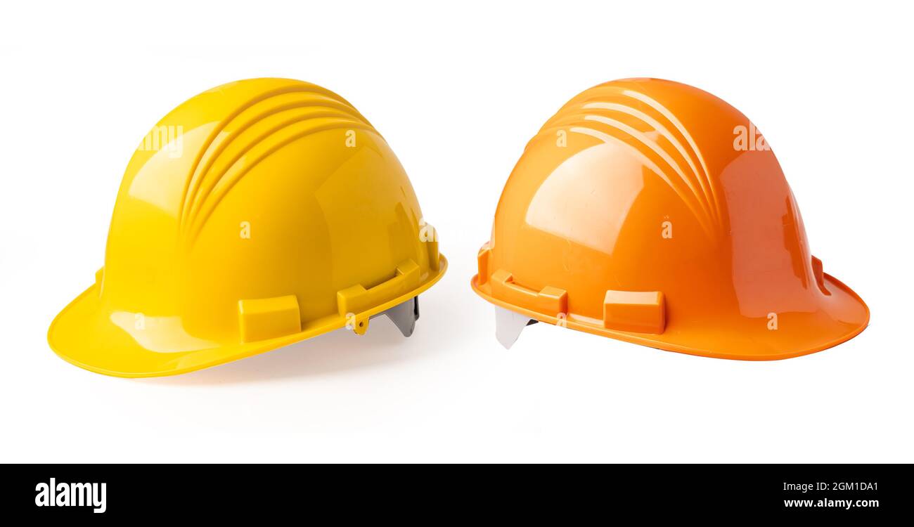 Yellow and Orange color construction helmet isolated on white ...