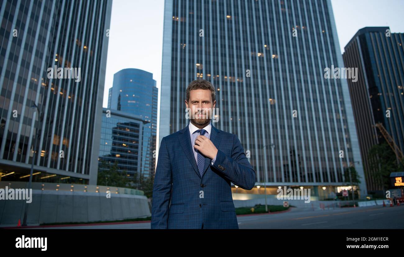 successful man in businesslike suit. manager executive outside the ...