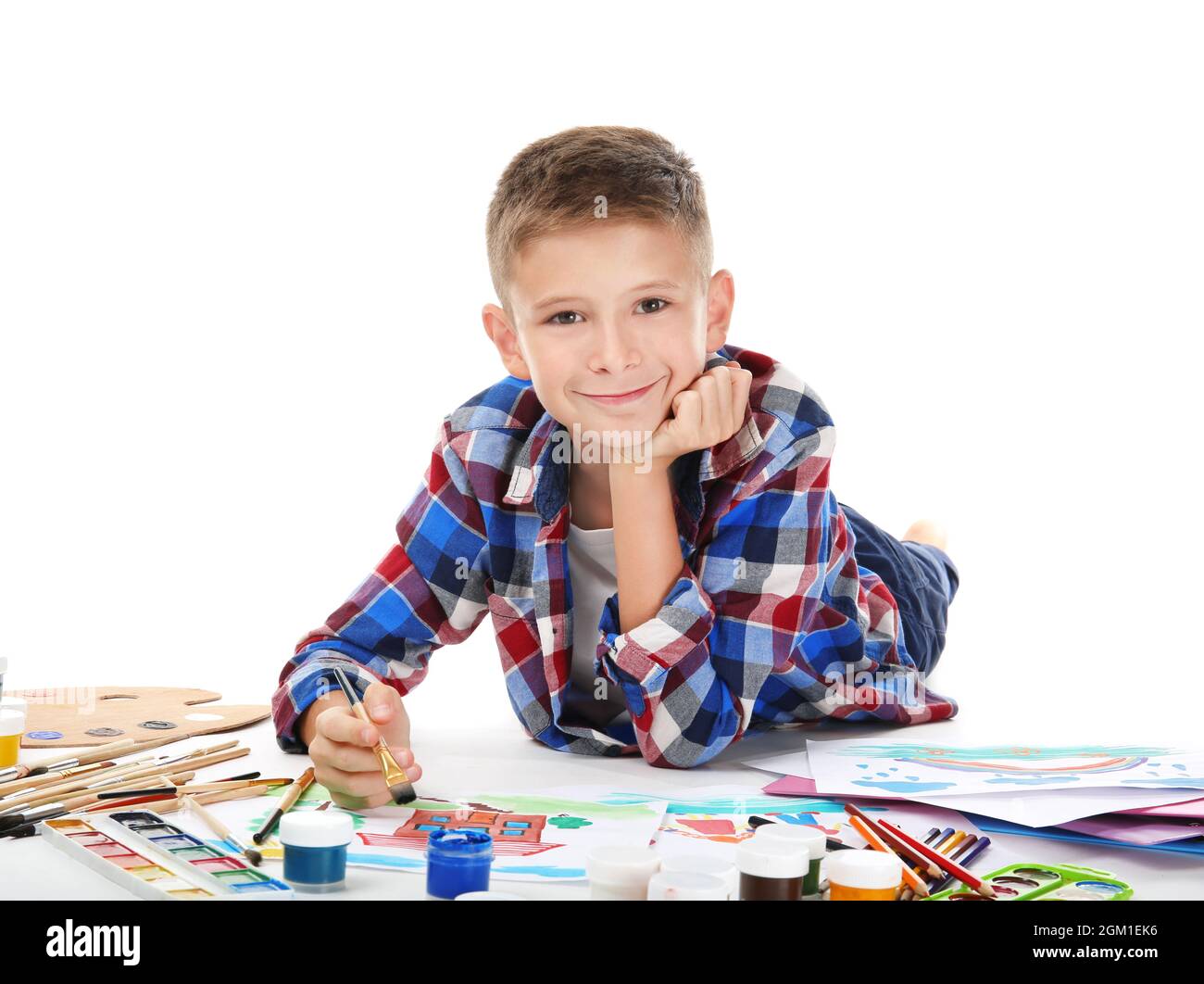 Cute little boy painting against white background Stock Photo - Alamy