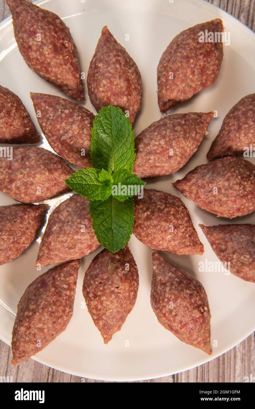 Traditional kebbe and pita bread on big round plate in lebanese ...