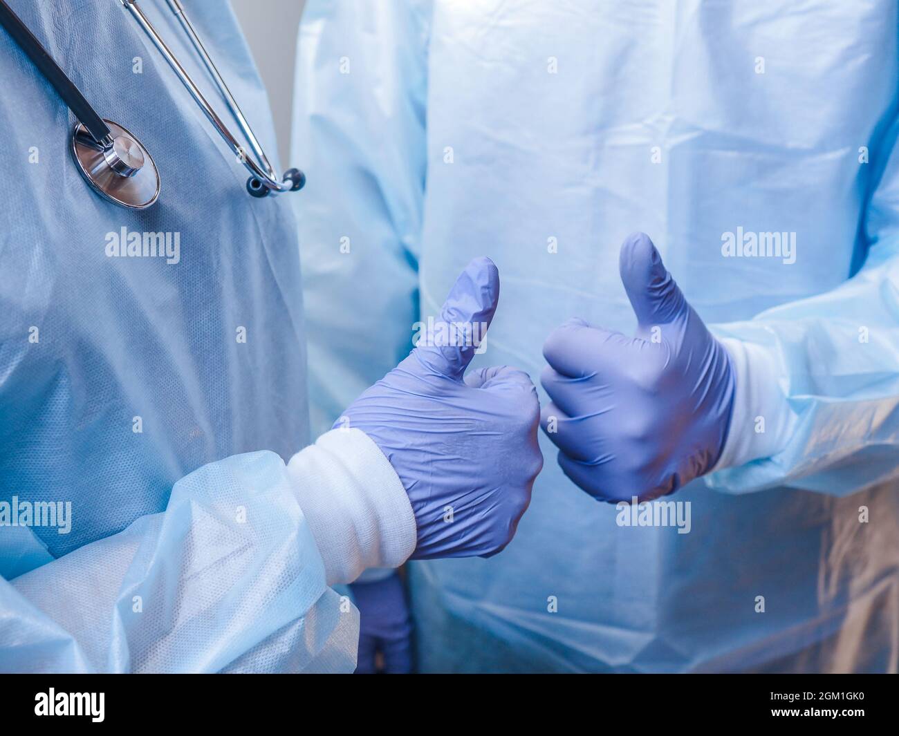 Doctors showing thumbs up indicating progress or success Stock Photo ...