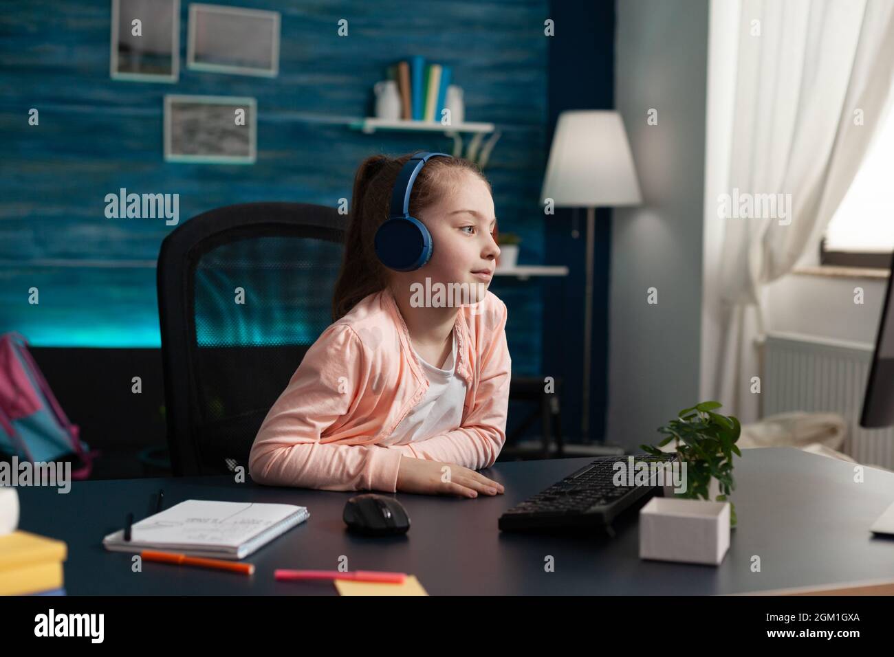 Caucasian student wearing headphones on online class using computer and ...