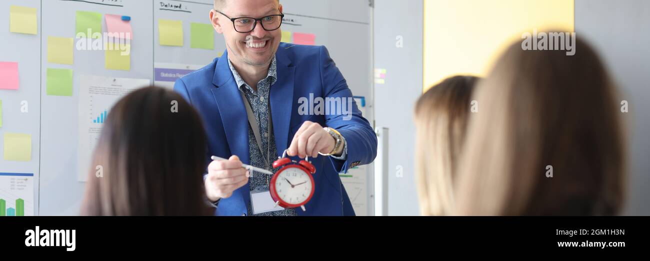 Training business coach conducts time management seminar for employees ...
