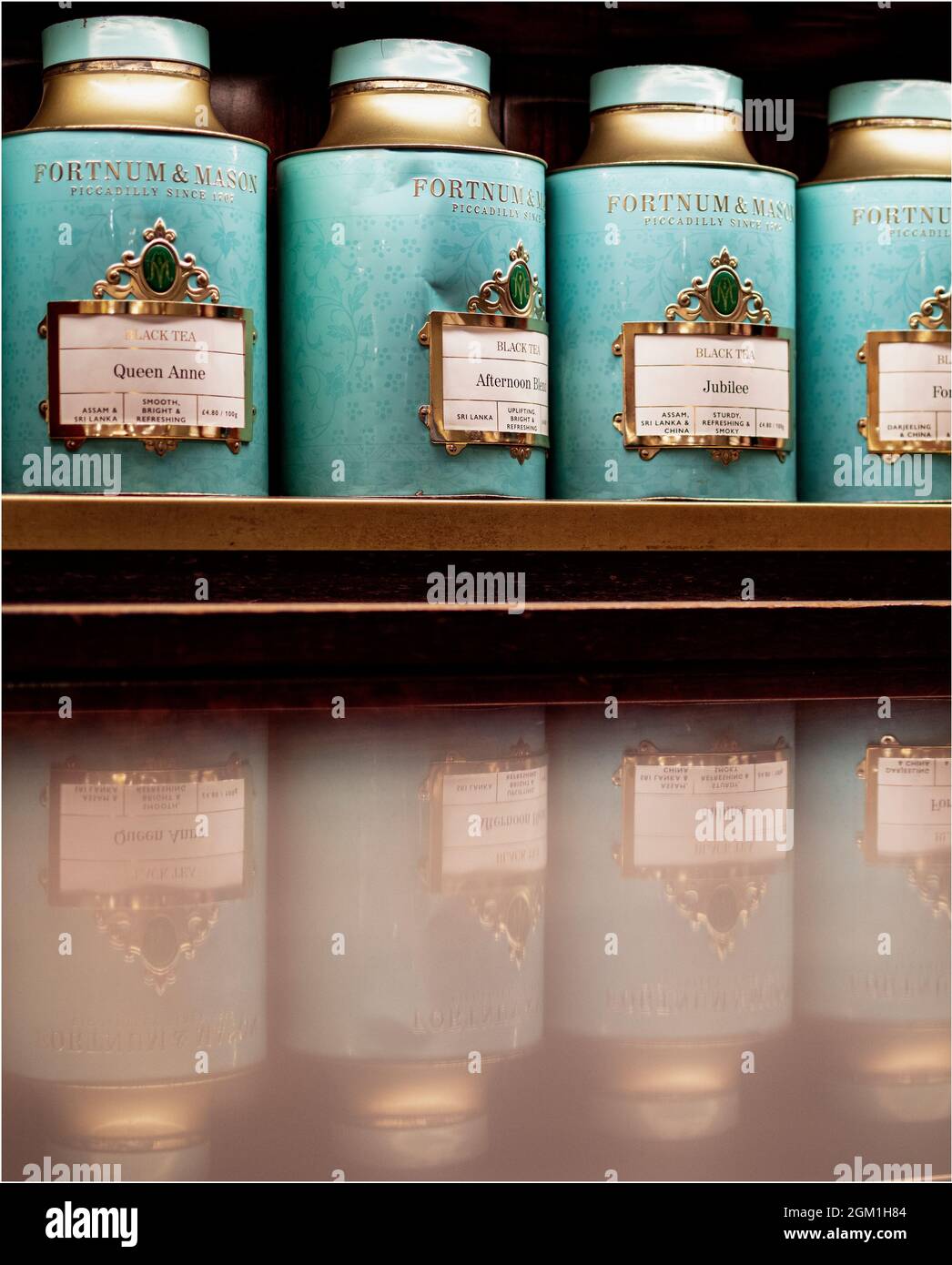 Large jars of tea on shelf display in the food hall of Fortnum & Mason ...