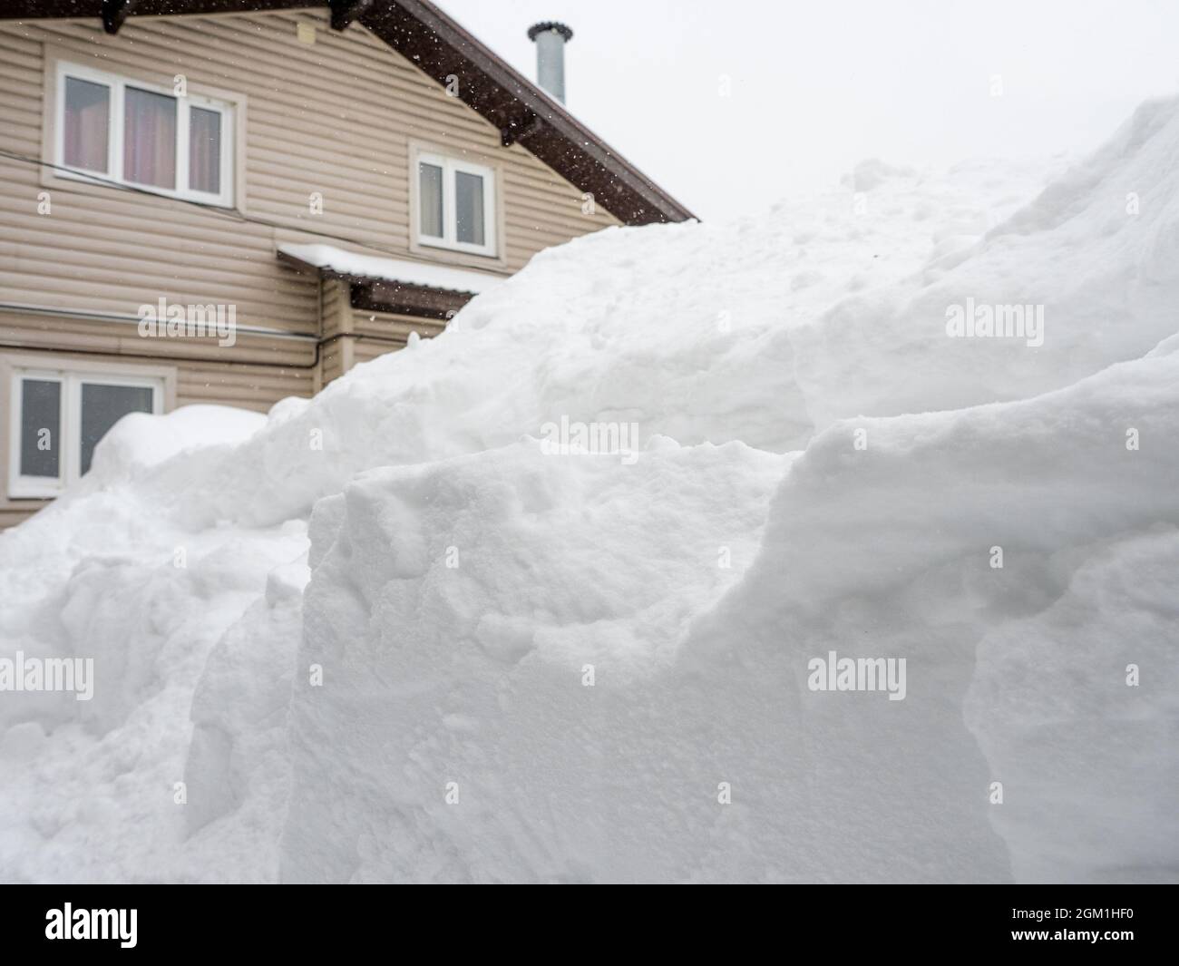 Huge heap of snow in front of the house after a heavy snowfall Stock ...
