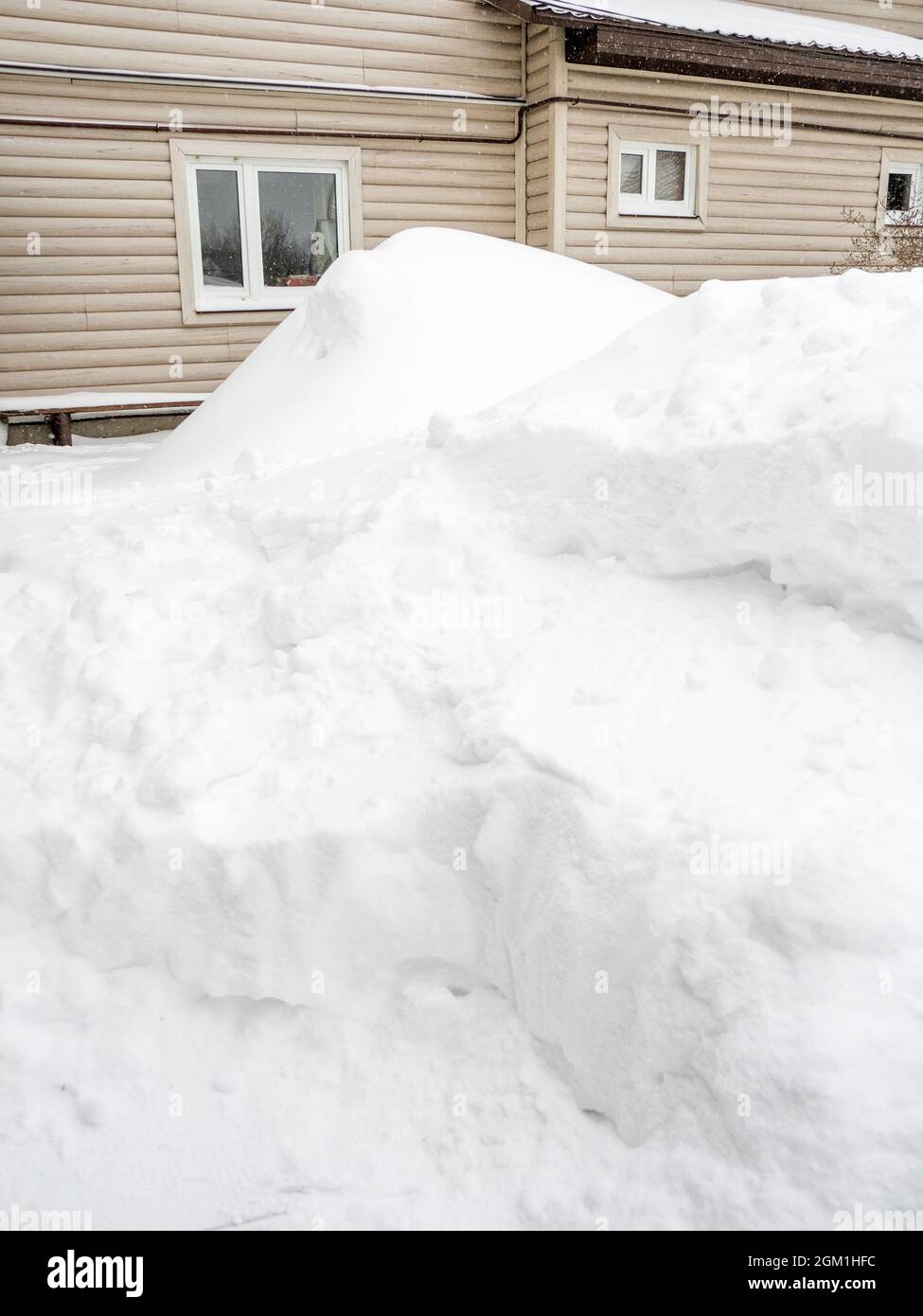 Huge heap of snow in front of the house after a heavy snowfall Stock ...