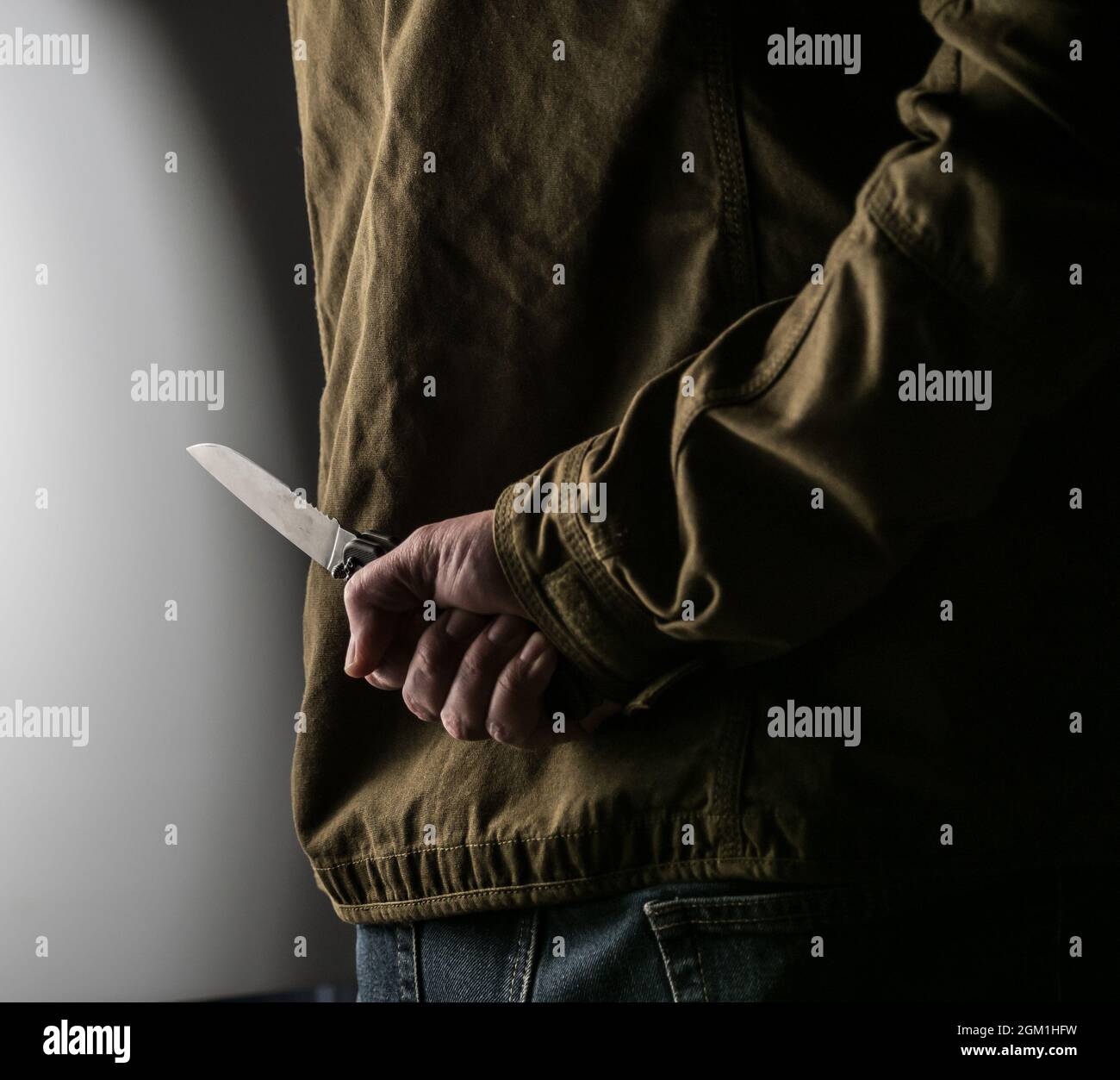 Concept man back with knife hi-res stock photography and images - Alamy