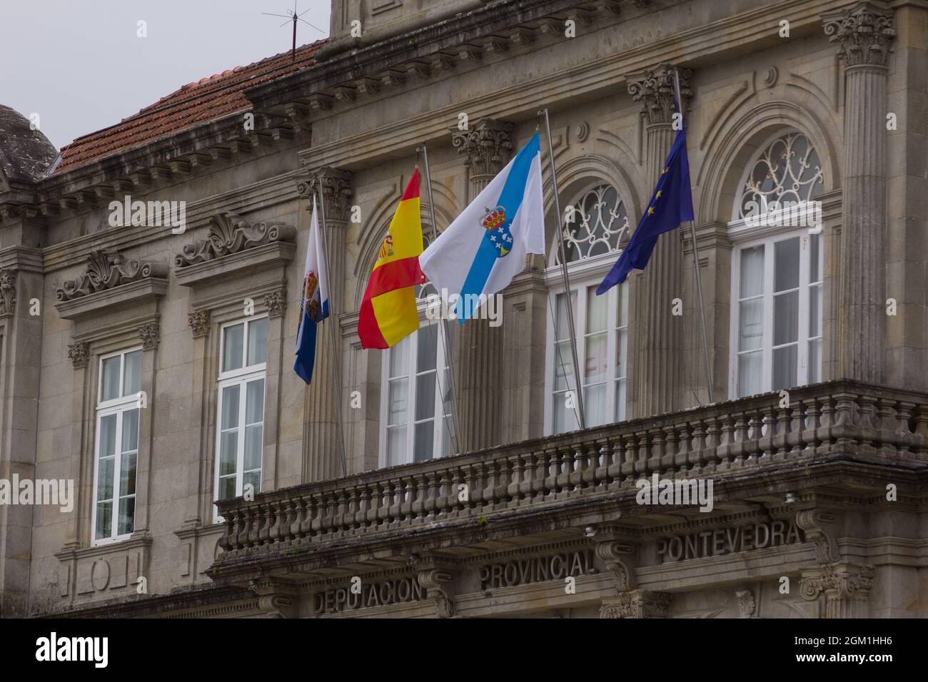 diversity of Flags in movement on the balcony of an official organism ...